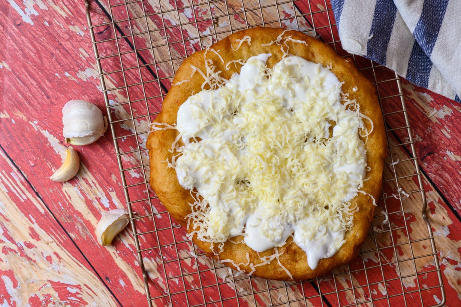 Hungarian Lángos: Fried Dough Topped with Garlic and Cheese ...